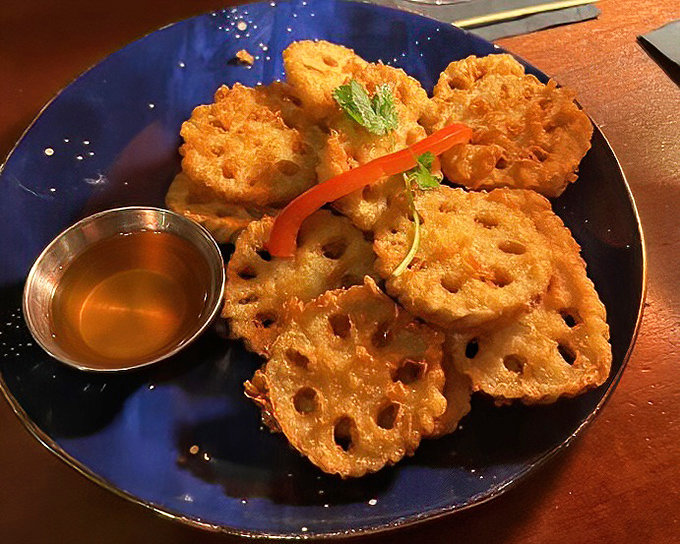Lotus root chips that transform a humble vegetable into addictive crispy discs &ndash; the kind of snack that disappears before conversation even begins.