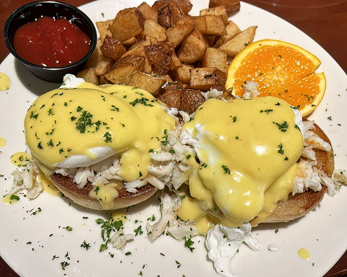 Crab Benedict that makes breakfast feel like a special occasion. Golden hollandaise cascades over delicate seafood&mdash;morning transformed.