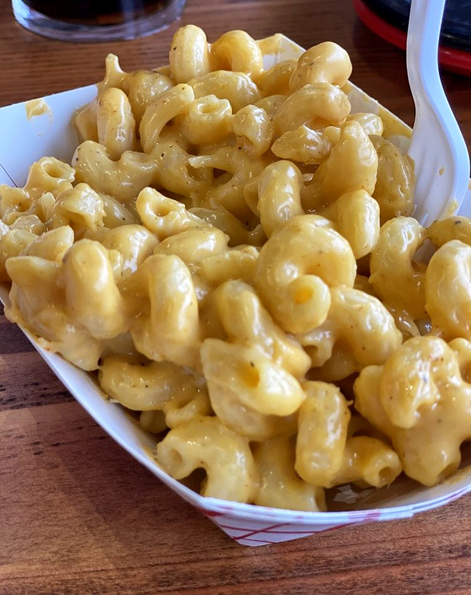 Mac and cheese so creamy and golden, it practically glows with cheesy perfection and carb-loaded happiness.