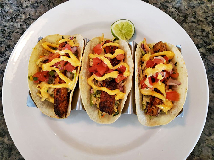 Fish tacos that make you question why you live so far from the ocean. The bright yellow sauce creates a sunset effect that's almost too pretty to eat. Almost.