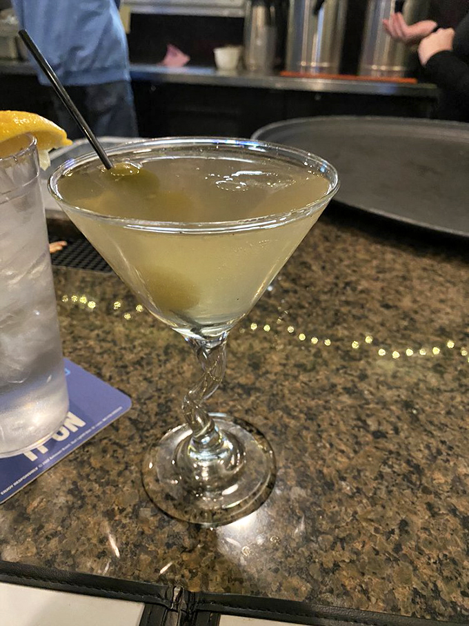 Crystal clear and perfectly chilled, this martini sits like liquid sophistication, waiting to transform an ordinary evening into something worth remembering.