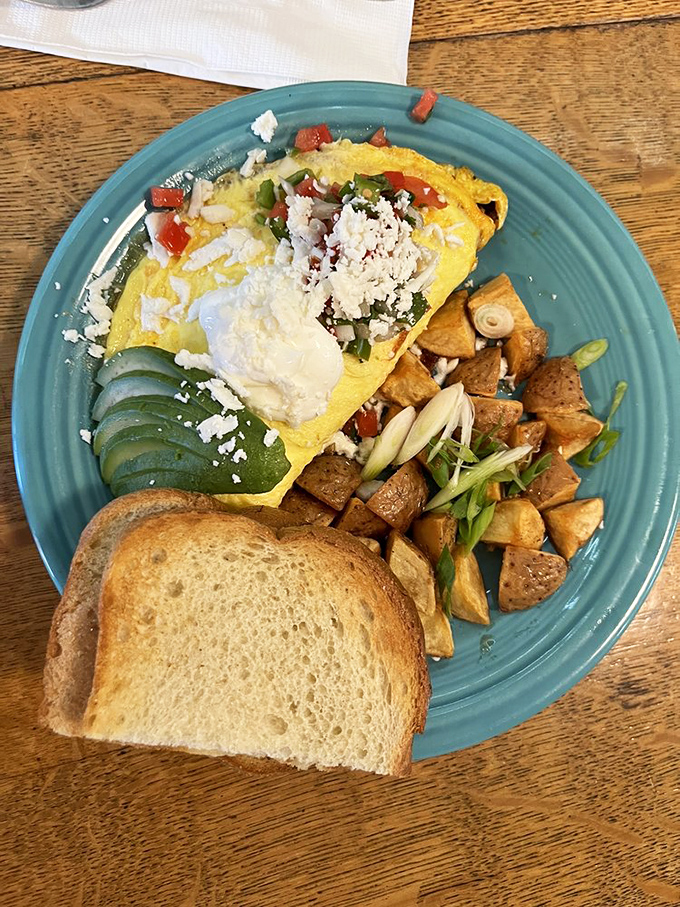 An omelet that doesn't just sit on the plate&mdash;it commands attention with vibrant colors and accompaniments that turn breakfast into an event.