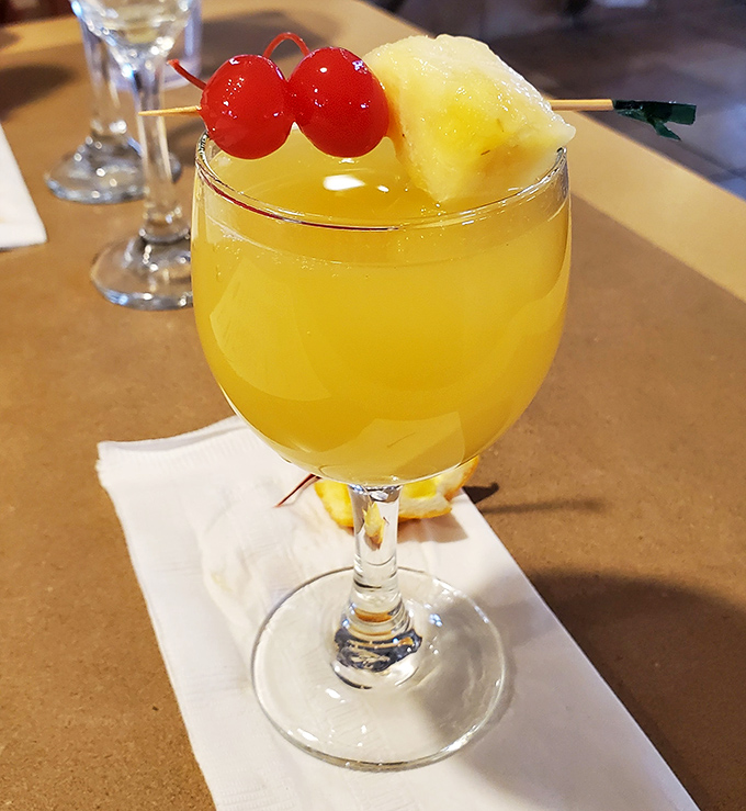 Weekend brunch gets a little sparkle with this sunshine-in-a-glass mimosa. Those maraschino cherries aren't just garnish—they're a promise.