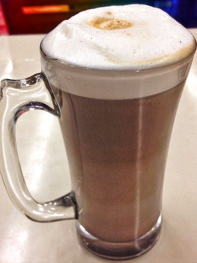 A mocha that doesn't need fancy latte art to impress &ndash; just honest coffee comfort topped with a cloud of whipped cream.