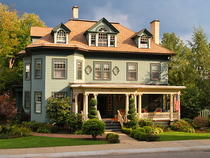 This picture-perfect Victorian home with its wraparound porch practically whispers, "Yes, you could afford me here," to city dwellers paying Manhattan rents.