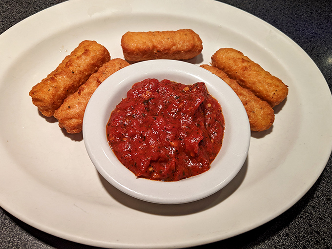 Crispy mozzarella sticks with marinara sauce prove that comfort food knows no time boundaries.
