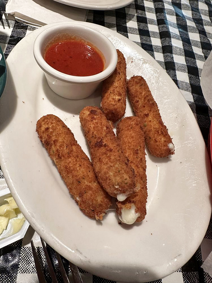 Golden, crispy, and stretchy - the holy trinity of mozzarella stick perfection achieved in every bite.