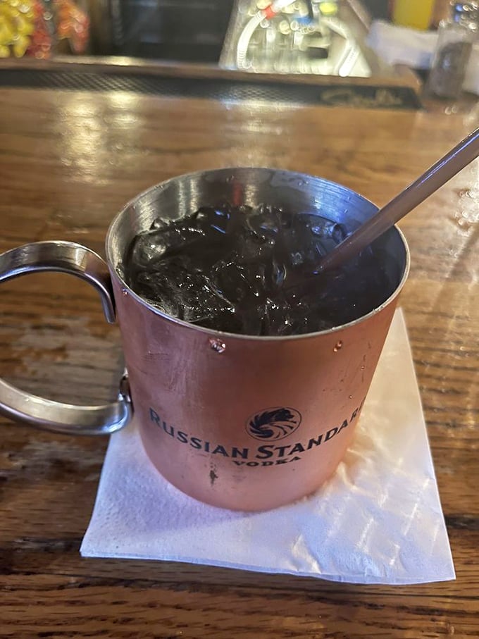 Ice cold mule in a branded mug &ndash; because some comforts transcend seasons and age limits.