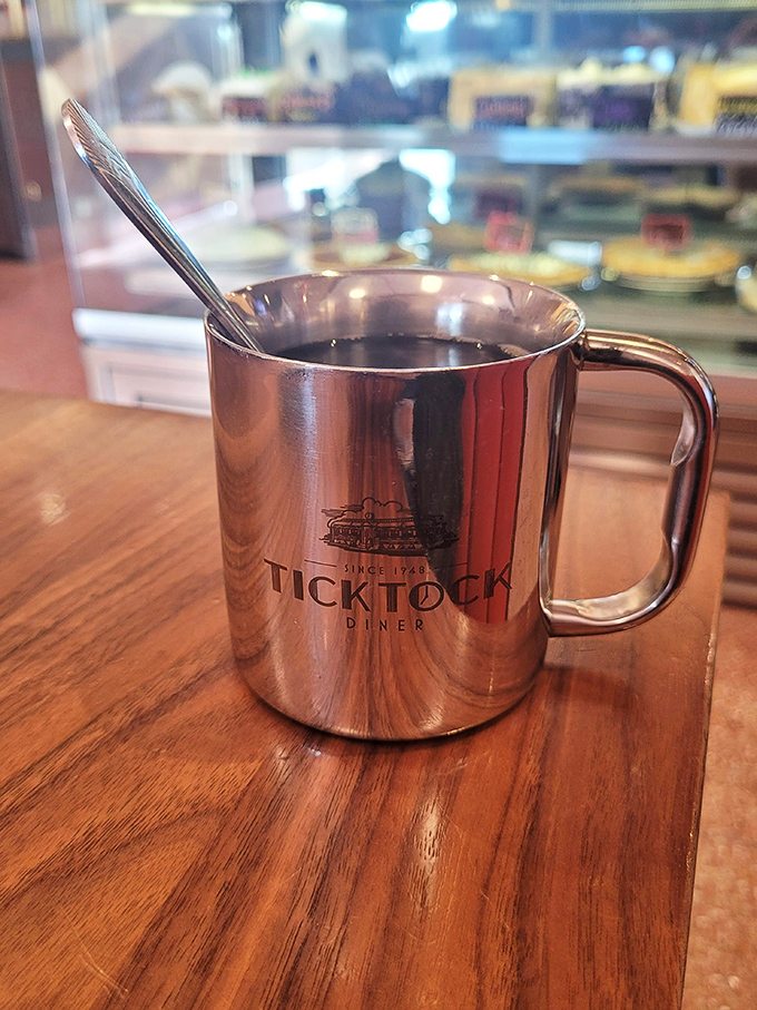 That metal coffee mug isn't just serving coffee—it's delivering a direct line to consciousness in a vessel that's seen more stories than a bartender on New Year's Eve.