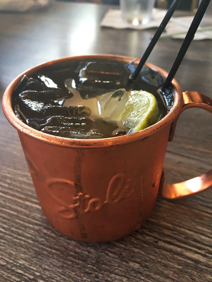 The Moscow Mule arrives in its proper copper vessel&mdash;cold, refreshing, and looking like it belongs in the hand of someone making better life choices than you.