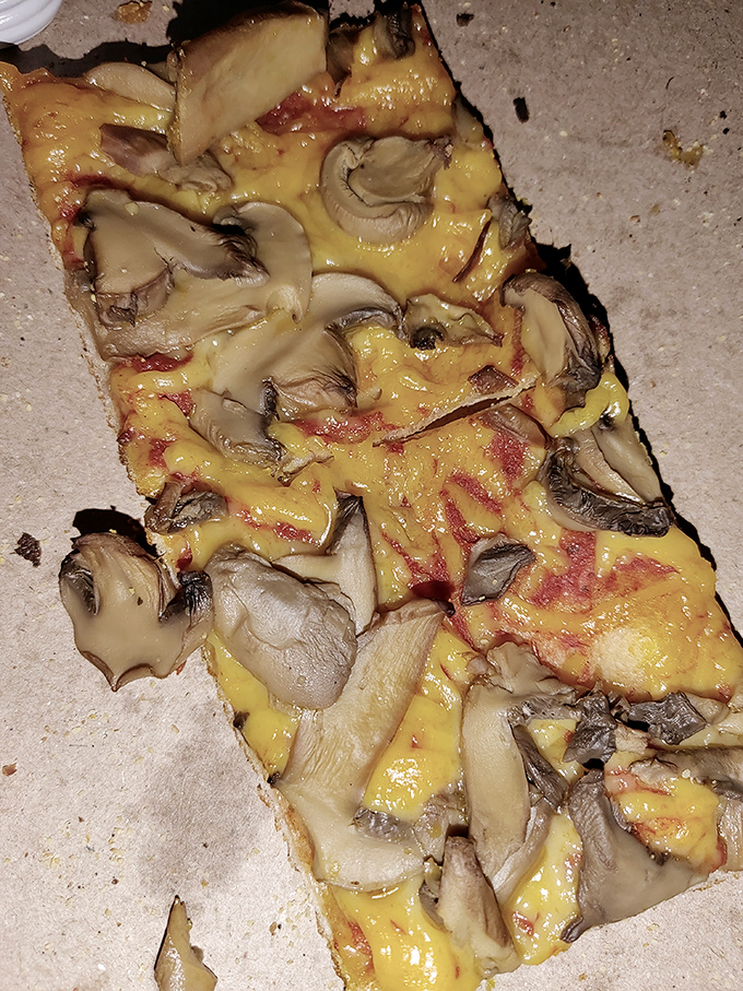 A mushroom pizza so good it might convert even the most dedicated fungi-phobes—earthy, cheesy perfection on a hand-crafted crust.