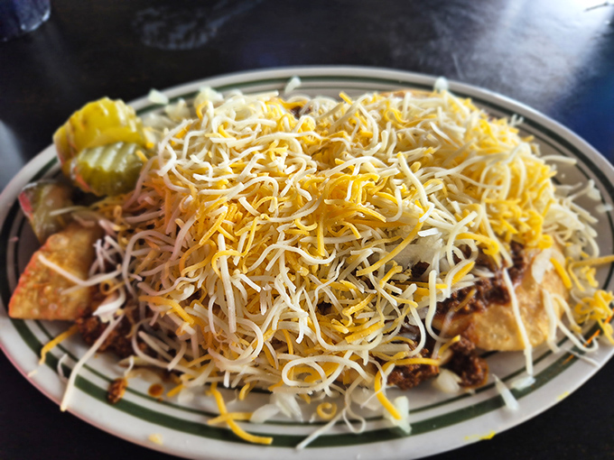 A mountain of nachos that requires a strategic eating plan. This isn't just a dish; it's an expedition worth every delicious step.