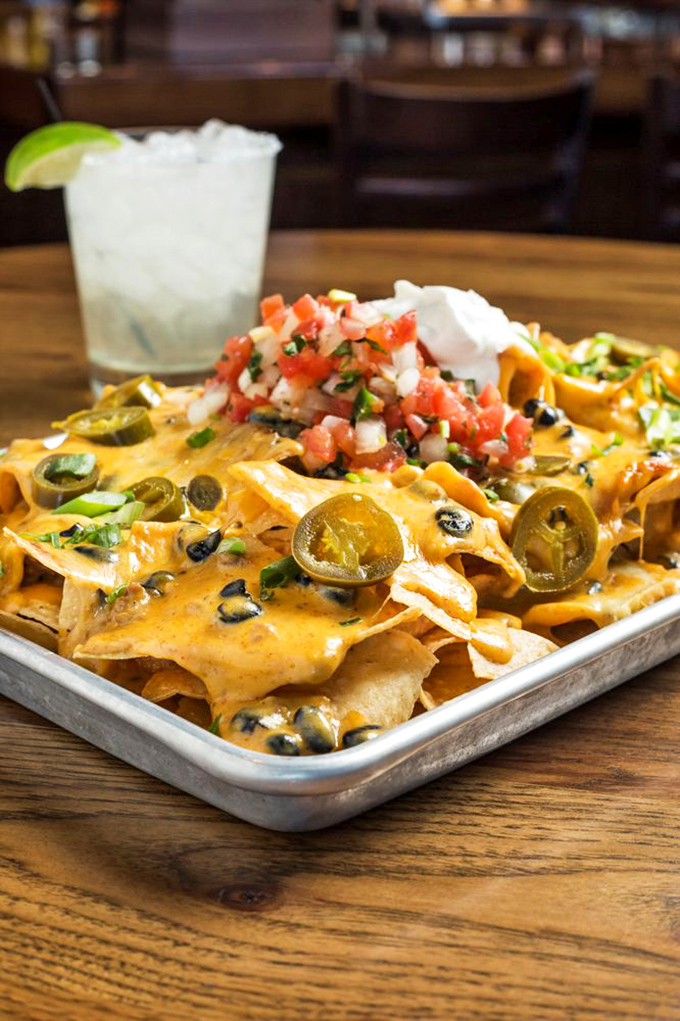 These aren't just nachos&mdash;they're an architectural marvel of chips, cheese, jalape&ntilde;os and fresh pico de gallo that demands to be shared (but you won't want to).