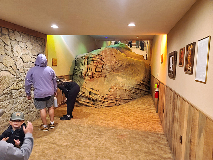 The entrance corridor sets the mood perfectly&mdash;part museum, part geological teaser. That rock formation is saying, "You ain't seen nothing yet, folks!"