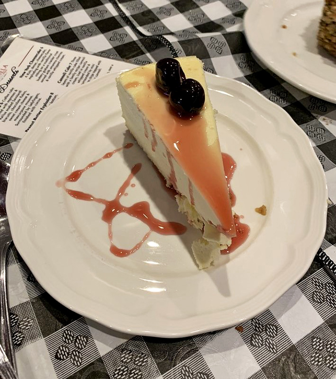 Cheesecake that makes you pause mid-conversation. That berry sauce isn't just decoration&mdash;it's the perfect sweet-tart counterpoint to creamy perfection.