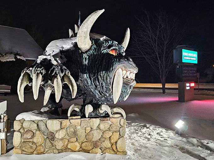 Night lighting transforms the Hodag into pure roadside magic, those eyes glowing like supernatural traffic signals.