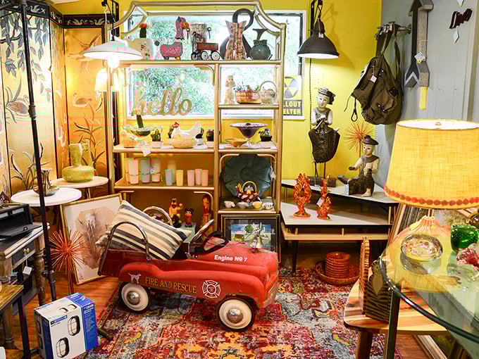 "Hello" indeed! This sunny yellow corner features a red pedal car that's probably seen more joy than most modern toys.