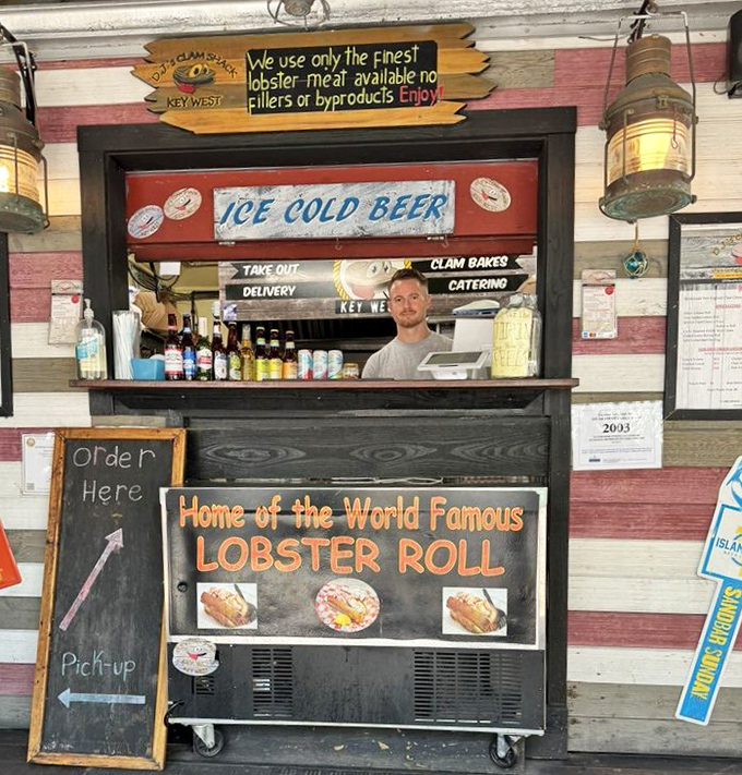 "Home of the World Famous Lobster Roll" isn't just marketing—it's a promise delivered daily through a humble order window framed by nautical charm.