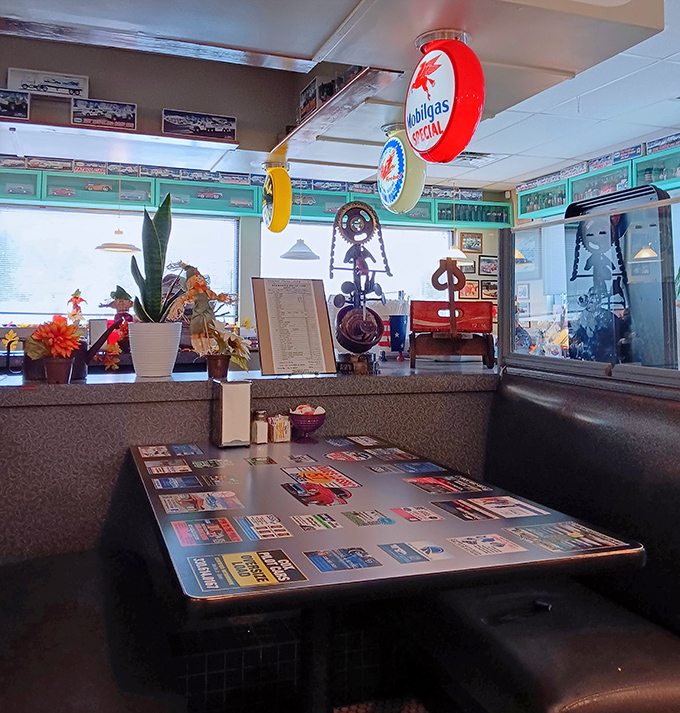 Every booth tells a story, while vintage gas station signs overhead remind you that this place runs on nostalgia and good taste.