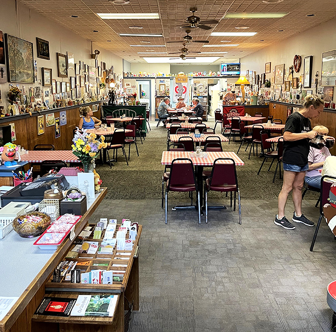 The dining room balances cozy and spacious, where red-checkered tables await beneath ceiling fans that have witnessed countless "mmms" of satisfaction.