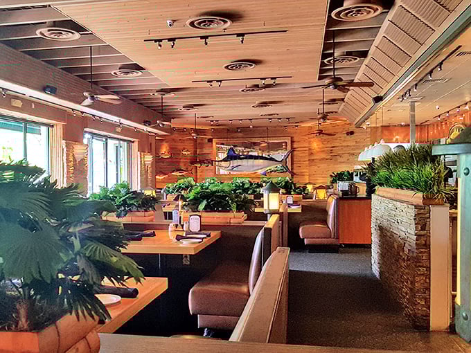 Warm wood paneling and lush greenery create an atmosphere where "just one more bite" becomes the evening's recurring theme.