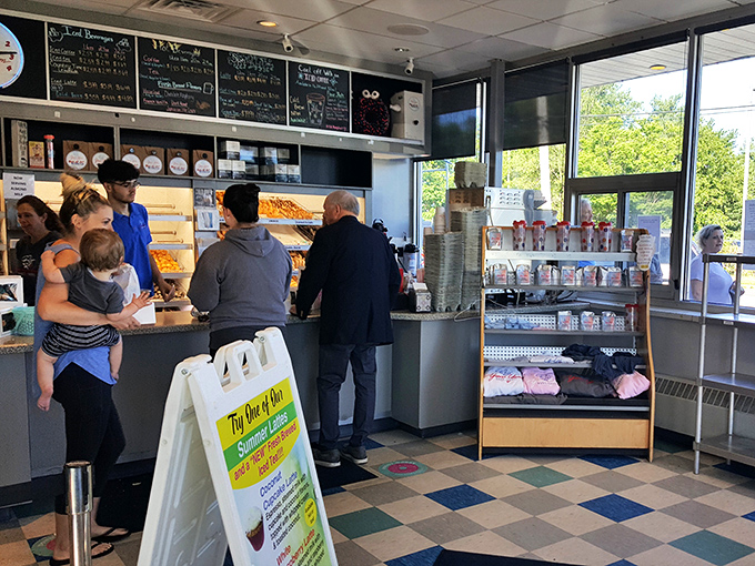 Behind the counter, skilled hands work their breakfast magic while customers wait in eager anticipation.