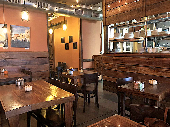 Wooden accents and warm lighting create the perfect backdrop for morning conversations that range from "pass the syrup" to solving world problems over a third coffee refill.
