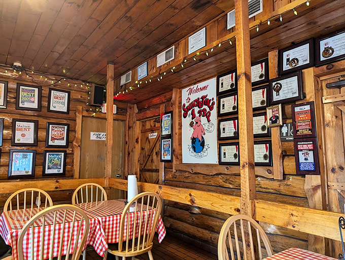 Awards line the walls like trophies in a champion's case &ndash; silent testimonials to decades of barbecue excellence in this wood-paneled sanctuary.