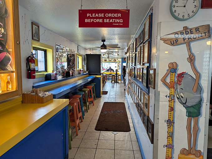 The narrow hallway feels like being backstage at a rock concert where seafood is the headliner. Order first, then find your seat!