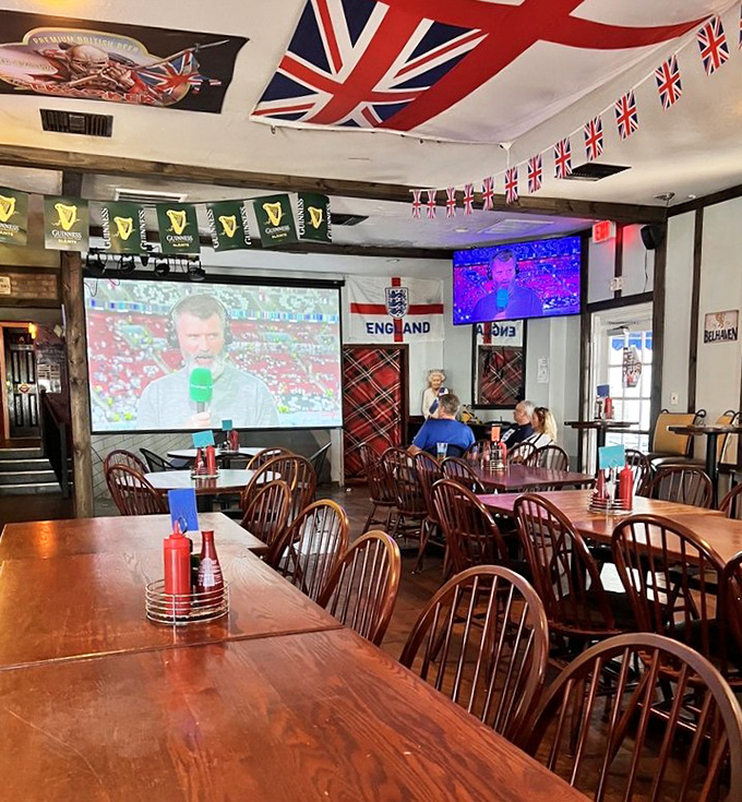 Union Jacks and Guinness flags hang proudly while football (never "soccer" here) plays on the big screen. Pure British sporting atmosphere!