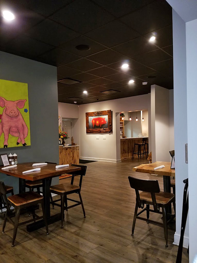 Whimsical pig artwork watches over diners like porcine guardian angels of good taste and hearty appetites.