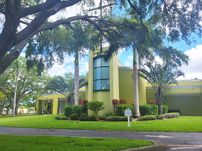 Our Lady of Lourdes Catholic Church's distinctive lime-green exterior stands out among Florida's palms like a tropical fruit ready to be picked.