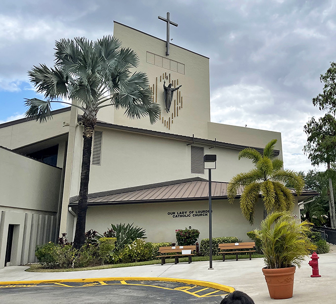 Our Lady of Lourdes Church combines Florida's signature palms with spiritual sanctuary, architectural harmony at its finest.