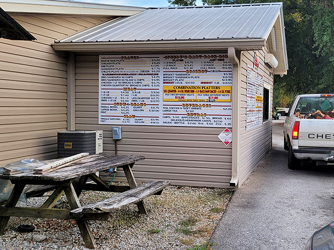 The drive-thru menu board&mdash;where barbecue dreams begin. Like a roadside oracle dispensing wisdom in the form of meat options.