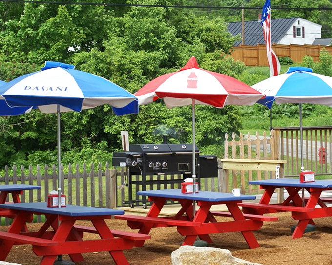 Summer dining at its finest&mdash;red picnic tables under patriotic umbrellas where the only thing better than the food is the New Hampshire fresh air.