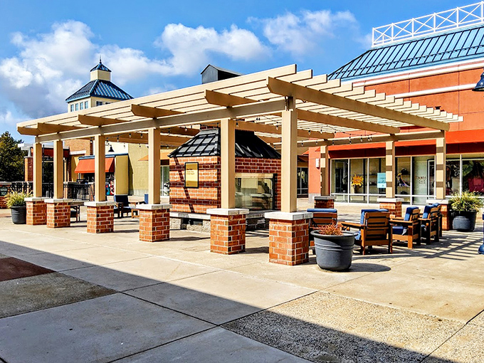 The outdoor oasis where exhausted shoppers recharge before round two. Those benches have heard more "I can't believe that price!" exclamations than a car dealership.