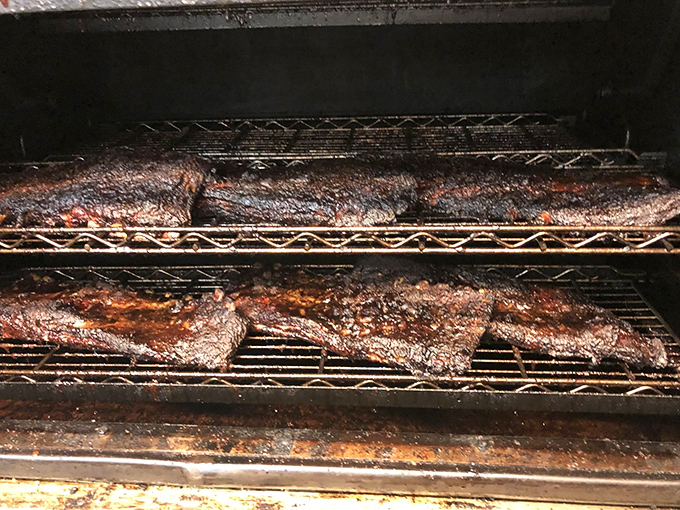 Where the magic happens &ndash; slabs of meat transforming in the smoker's embrace, a process that can't be rushed or faked.