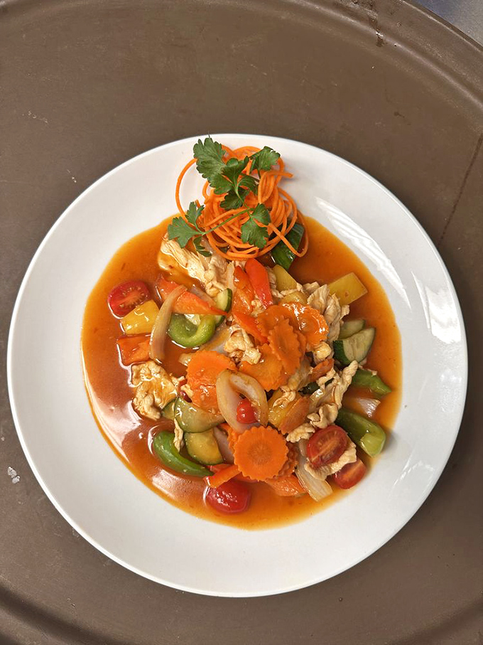 A symphony of colors and textures in this Pad Priew Wan. The sauce is doing the backstroke around islands of vegetables and protein&mdash;vacation on a plate.