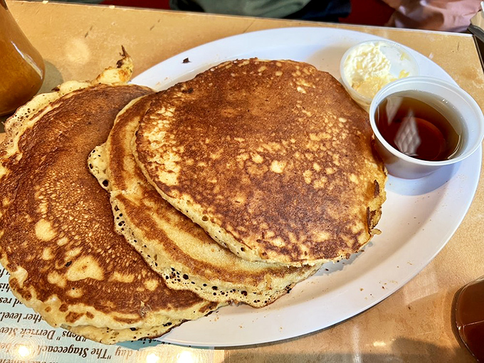 Fluffy pancakes stack up like edible clouds, proving that some breakfast dreams do come true on plates.