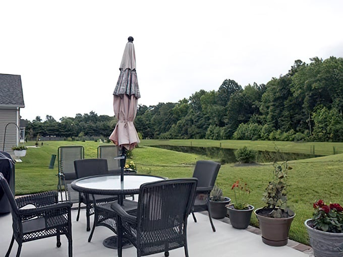 Backyard patios overlooking peaceful green spaces&mdash;the perfect setting for morning coffee, evening wine, or midday napping disguised as "enjoying nature."