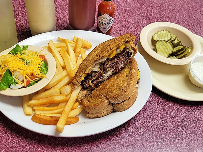 The patty melt &ndash; that brilliant marriage of burger and grilled cheese &ndash; flanked by crispy fries and a token salad for "balance."