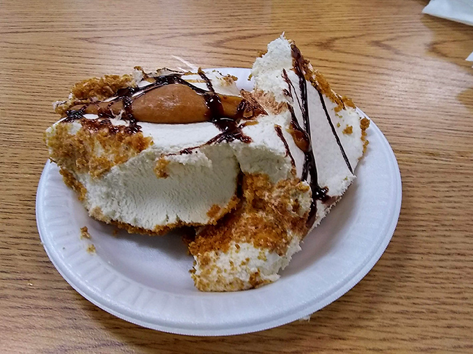 This isn't just dessert—it's therapy with a chocolate drizzle. The kind of cheesecake that makes you consider asking for the recipe, then realize you're happier not knowing.