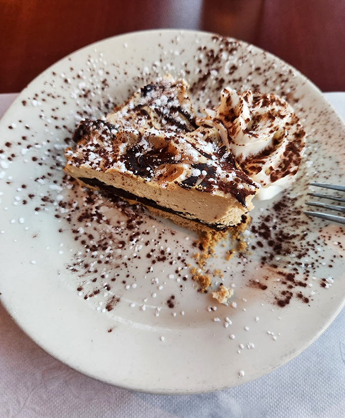 This isn't just dessert&mdash;it's a chocolate meditation with powdered sugar benediction. A sweet finale that demands you slow down and savor every forkful.