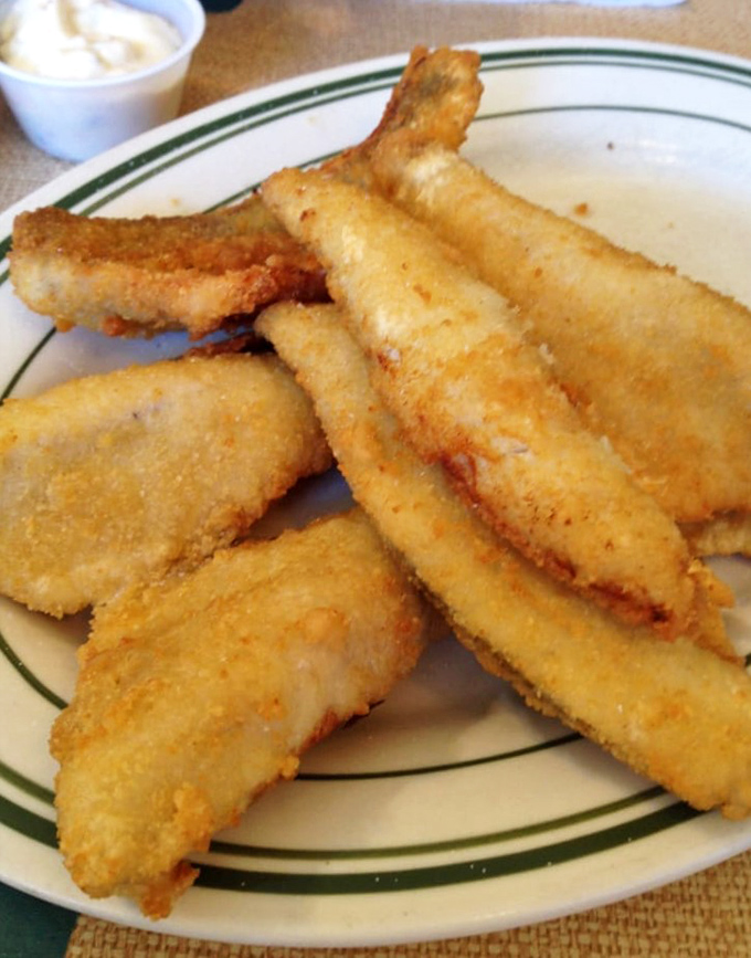 Fresh perch that's been given the golden treatment it deserves, crispy outside and flaky perfection within.