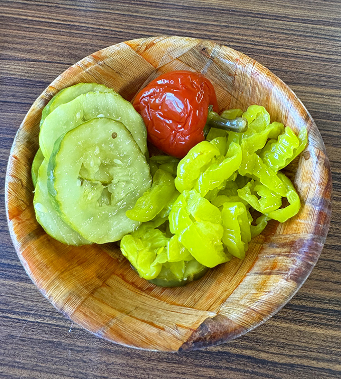 The pickle plate &ndash; nature's palate cleanser &ndash; offers tangy, crunchy respite between bites of cheesesteak, proving that supporting characters matter too.