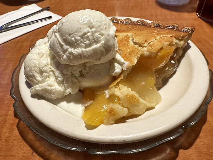 Apple pie that doesn't just arrive &agrave; la mode&mdash;it arrives with ice cream melting into warm filling like it's auditioning for a dessert commercial.