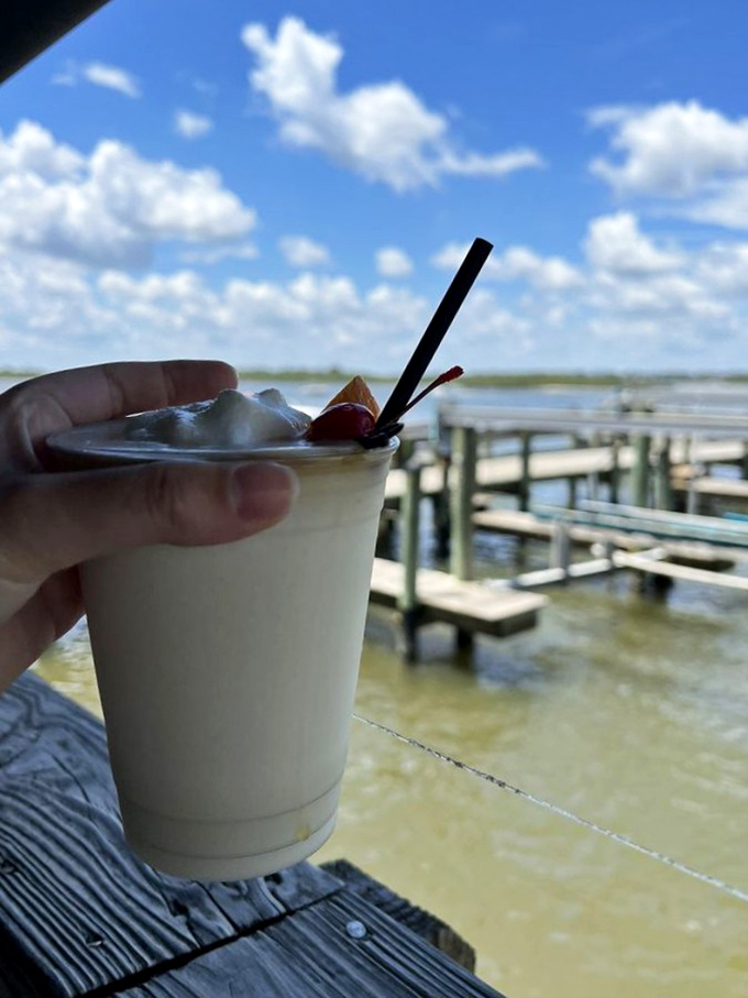 Nothing says "I'm on vacation even if I live here" like a frozen drink with a water view that costs more in therapy than it does here.