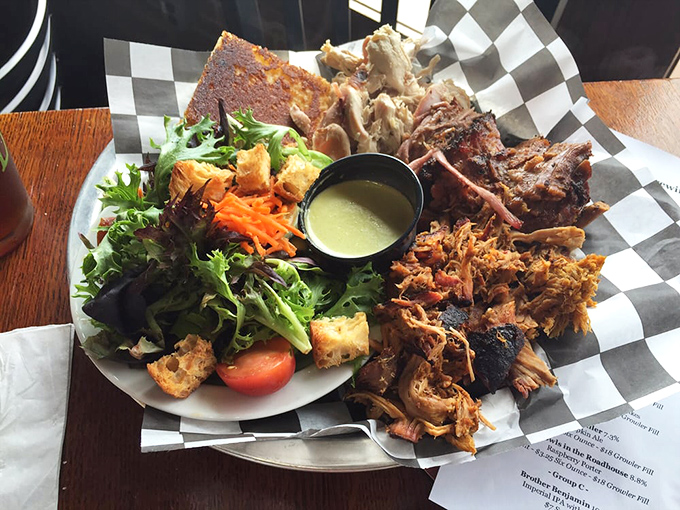 A barbecue platter that serves as both meal and conversation piece. That cornbread isn't just a side&mdash;it's the perfect tool for sopping up every last drop.