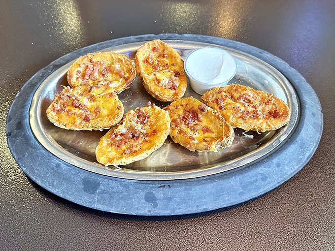 Potato skins that make you question why you've wasted time on lesser versions. Cheese melted to perfection—the kind of appetizer that ruins friendships over who gets the last one.
