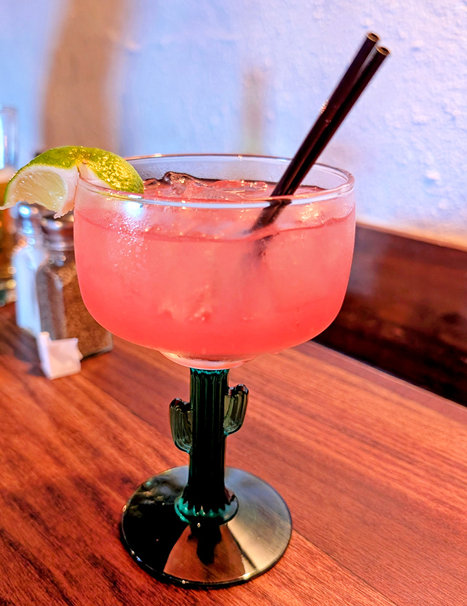 The prickly pear margarita&mdash;where desert fruit meets tequila in a glass that screams "vacation mode activated." That cactus stem is Arizona's version of a tiny umbrella.